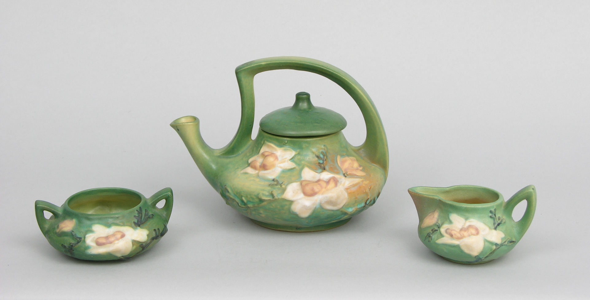 A Roseville Pottery Magnolia Tea Set , 05.18.07, Sold: $103.5