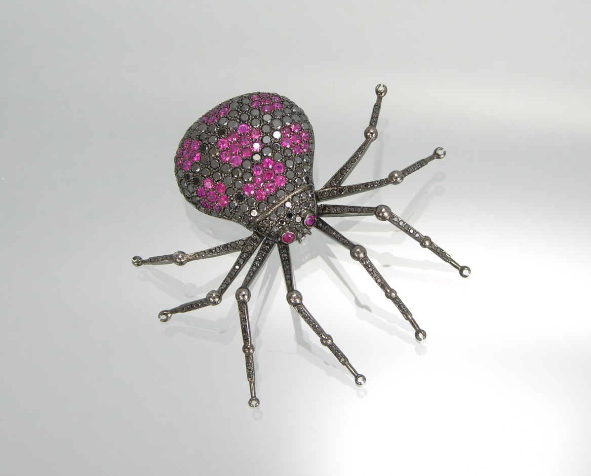A Black Diamond and Ruby Spider Brooch, 05.15.09