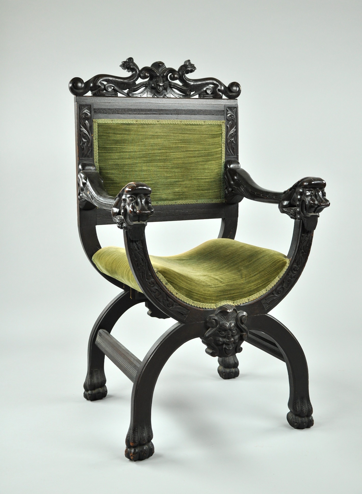 A Carved Devil Motif Arm Chair, 11.21.09, Sold: $241.5