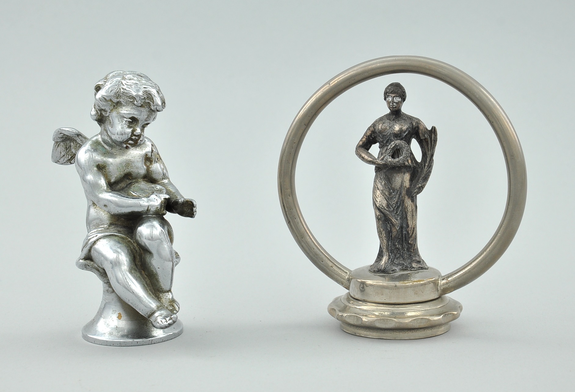 A Lot of Two Antique Automotive Mascots, 09.24.09, Sold: $115