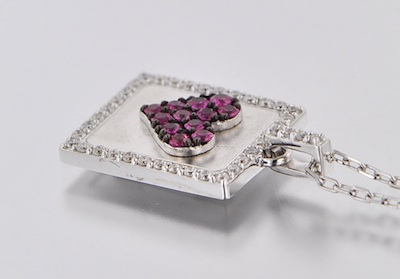 A Diamond and Ruby "Ace of Hearts" Pendant with Chain by Mirabelle , 03 ...