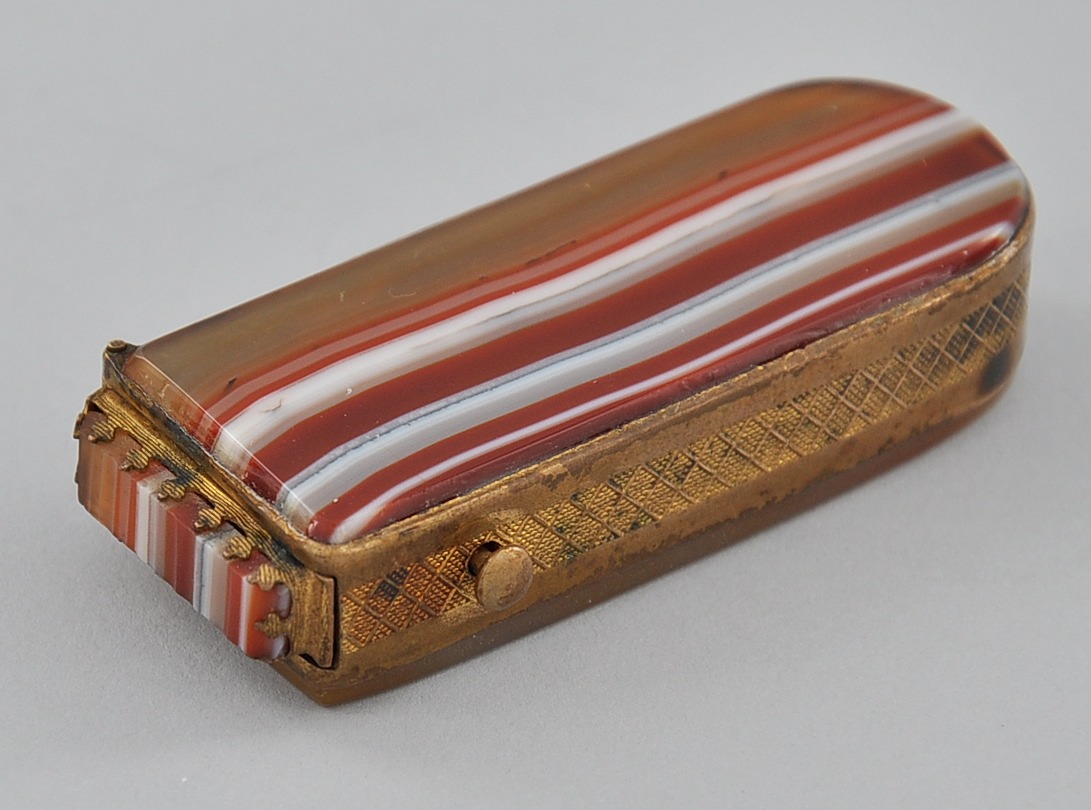 An Agate and Gilt Metal Match Safe, 03.04.10, Sold: $293.25