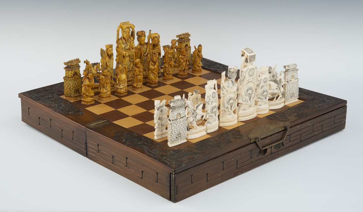 A Carved Ivory Chess Set and Game Board Box, 01.27.11, Sold: $529