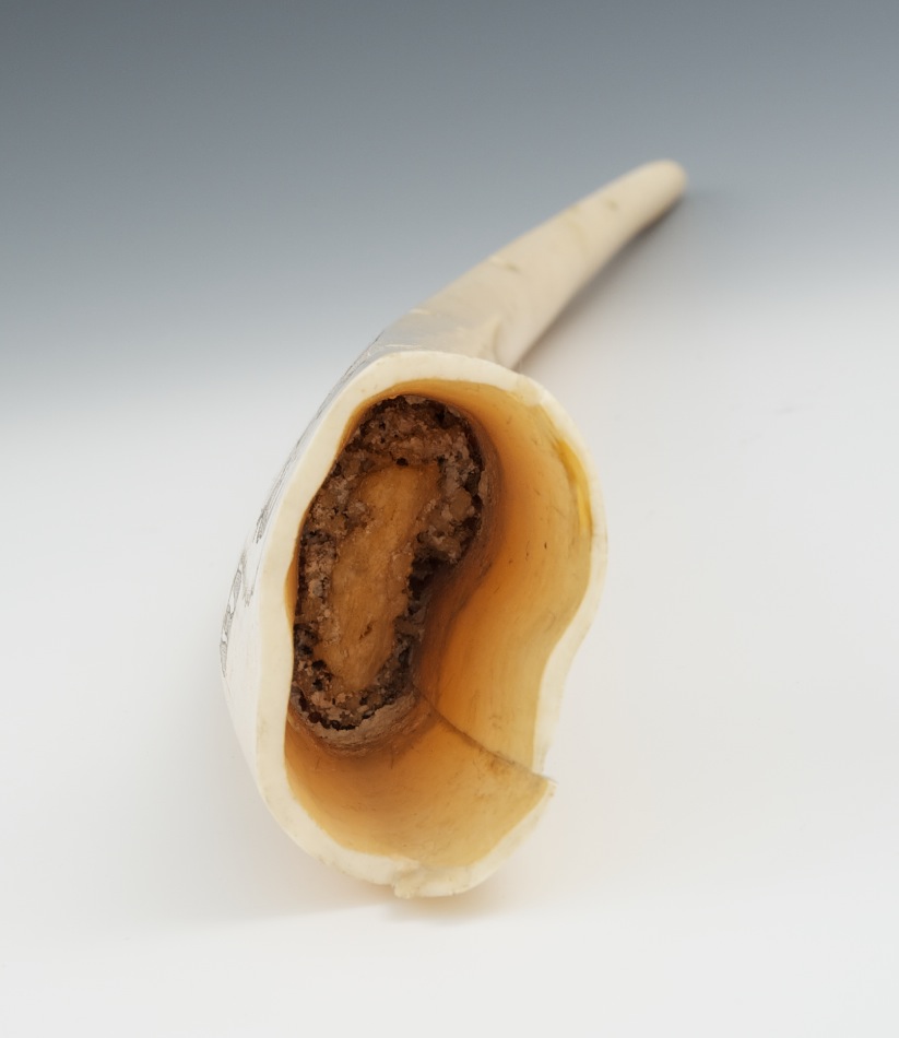 What is this carved tusk? Is this handmade/authentic? Would live to ...