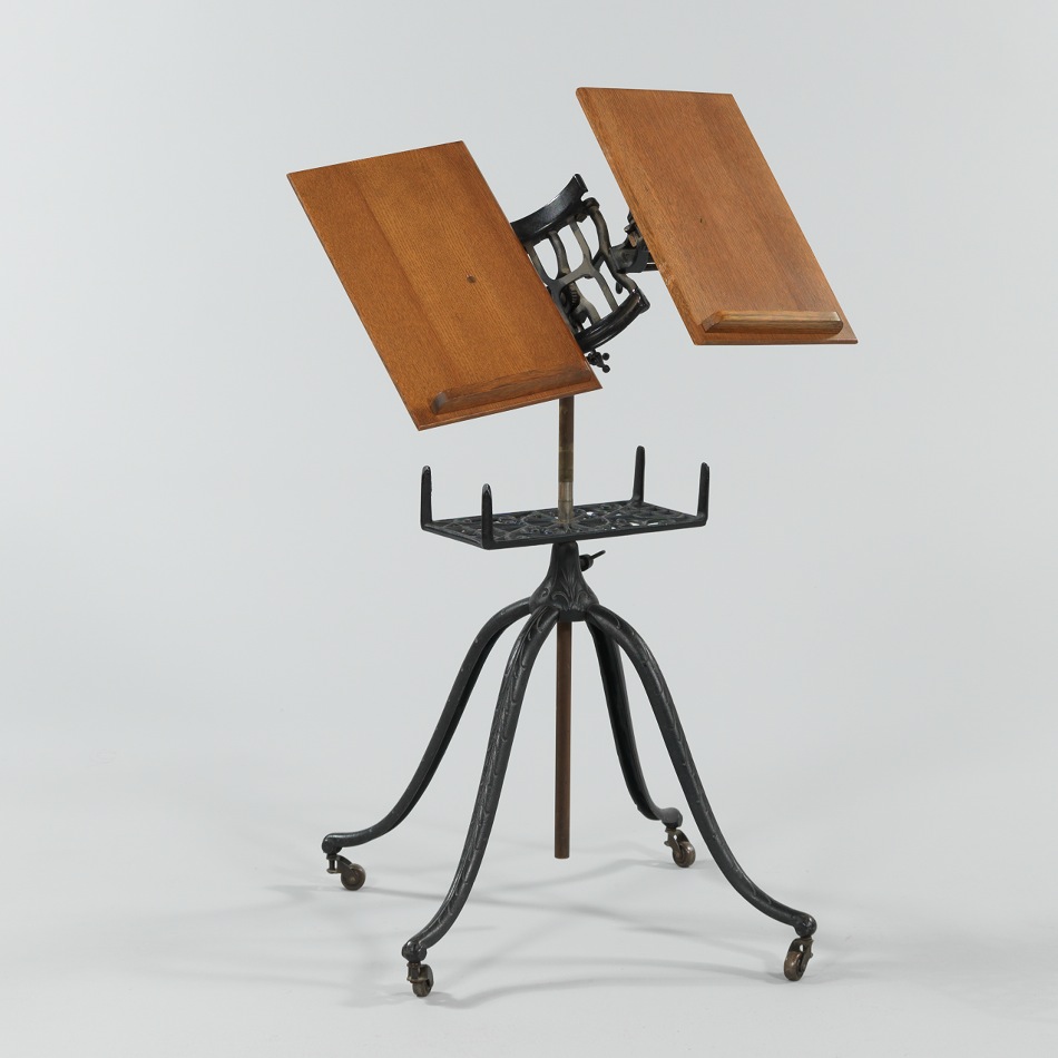 An Antique Cast Iron and Oak Dictionary Stand, 09.08.12, Sold: $333.5