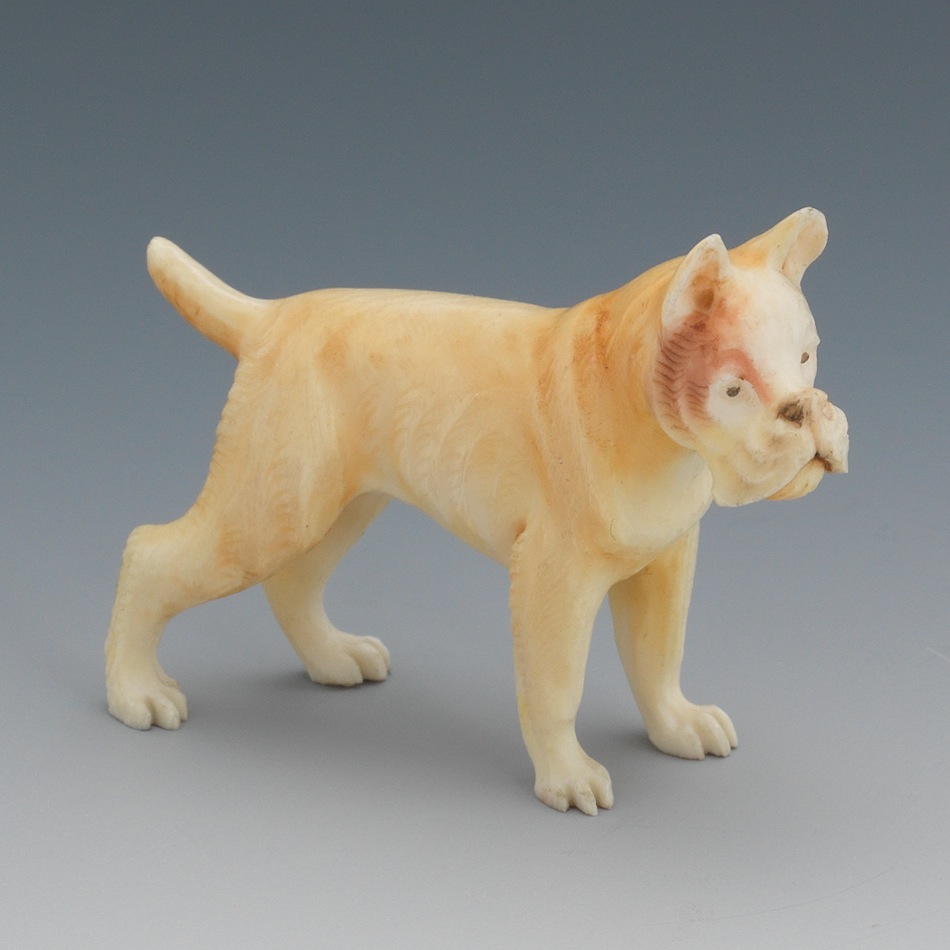 A Carved Ivory Figure of a Boxer Puppy, 09.08.12, Sold: $161