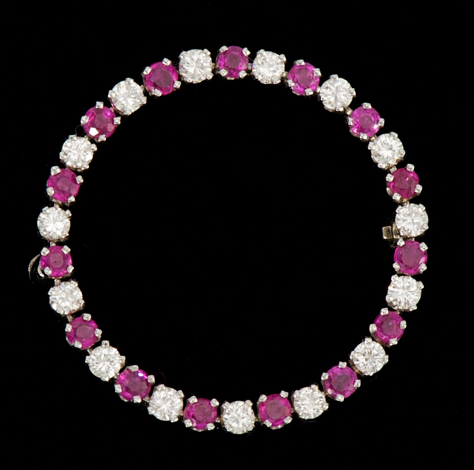 A Ladies' Diamond and Ruby Circle Pin , 09.07.12, Sold: $345