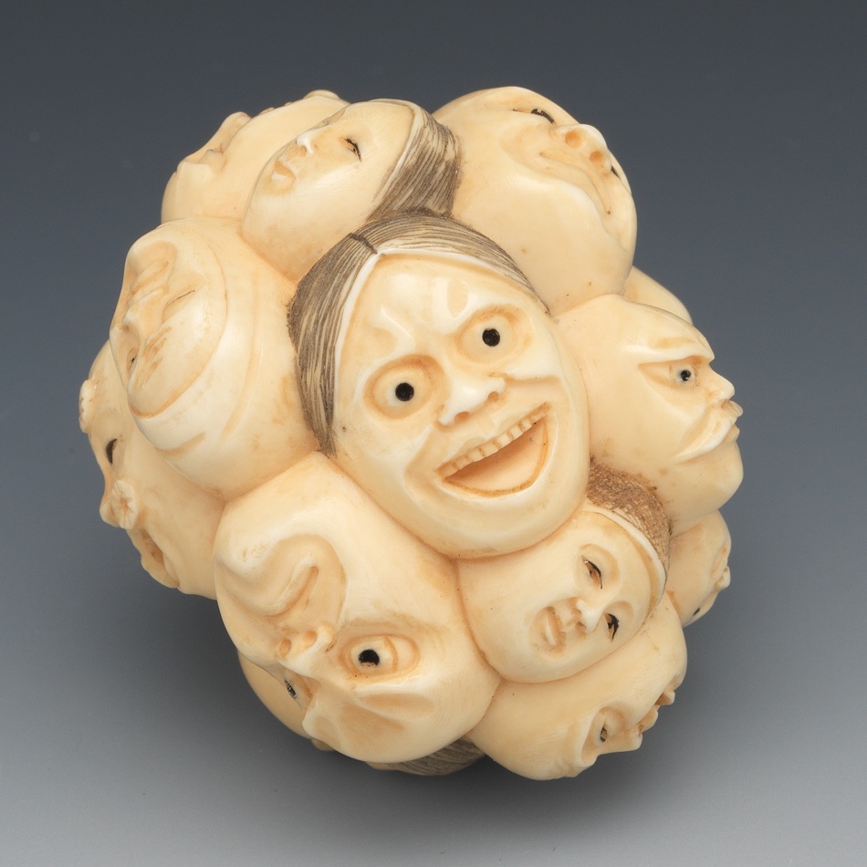 A Carved Ivory Mask Ball Okimono, 03.21.13, Sold: $230
