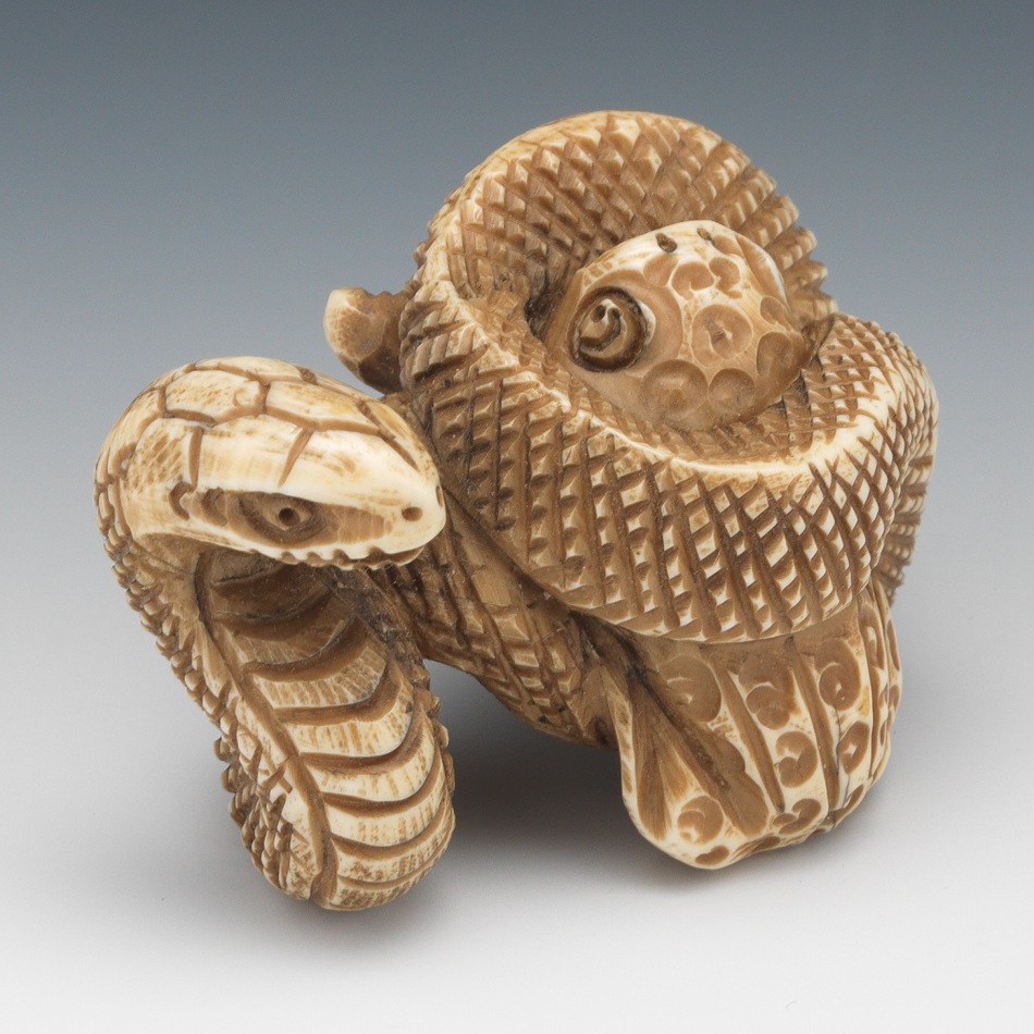 A Carved Ivory Netsuke of a Snake and Toad, 03.21.13, Sold: $92