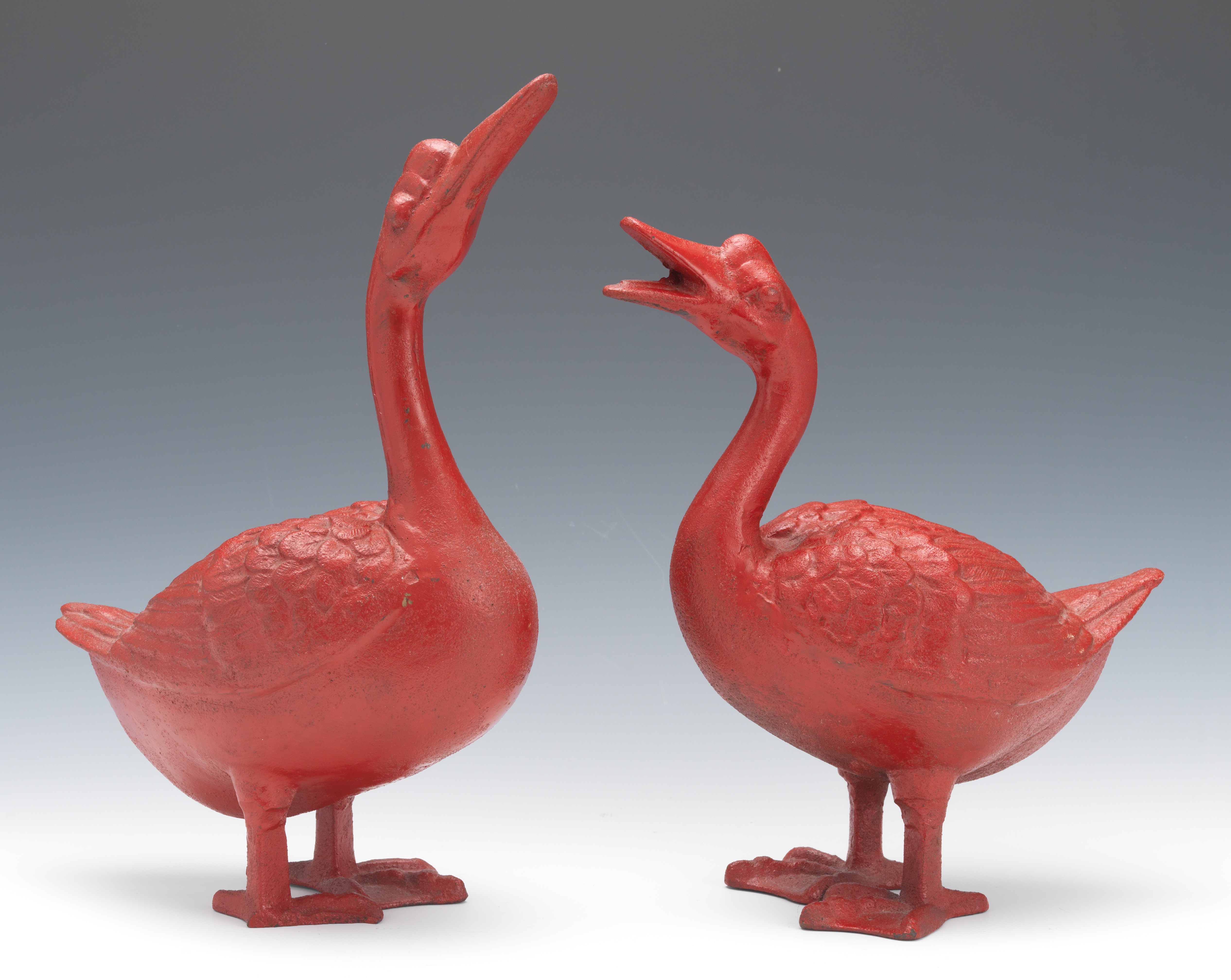 High resolution image for A Pair of Red Cast Iron Geese