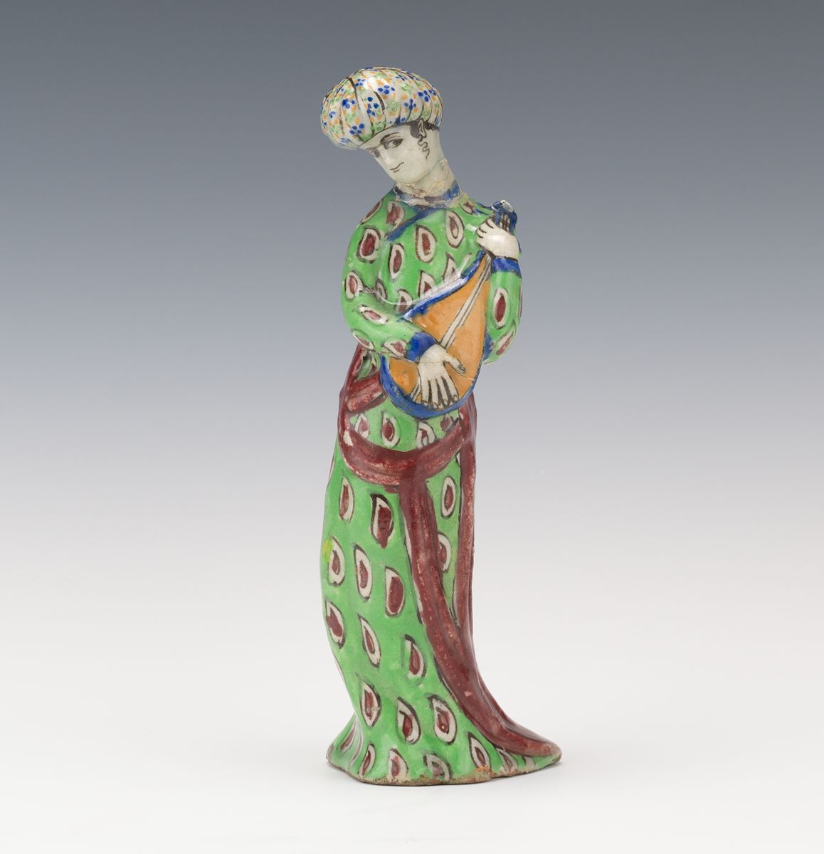 A Persian Ceramic Figure of a Musician , 10.30.14, Sold: $120.75